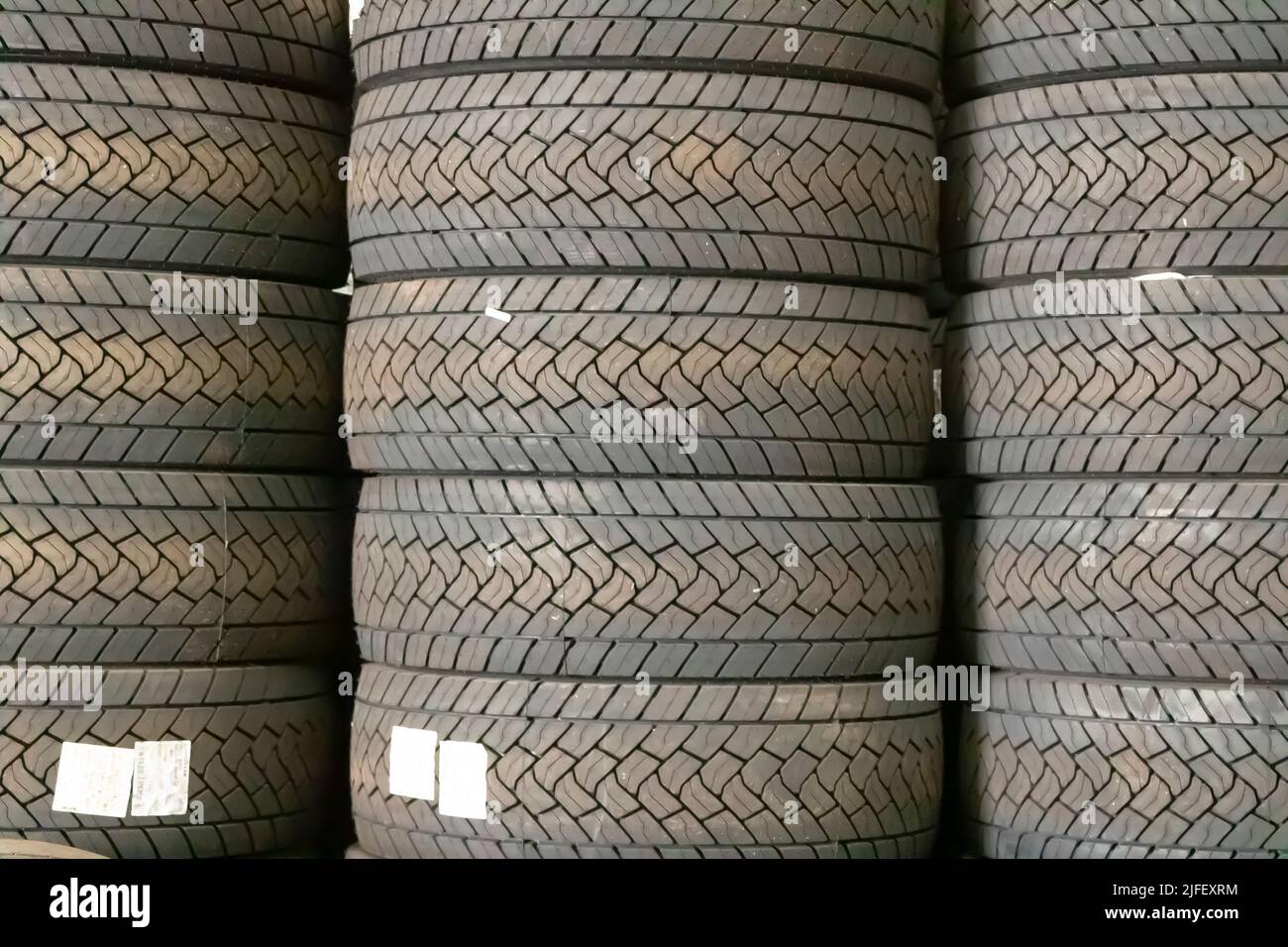 Pile of tires in a Workshop Stock Photo - Alamy