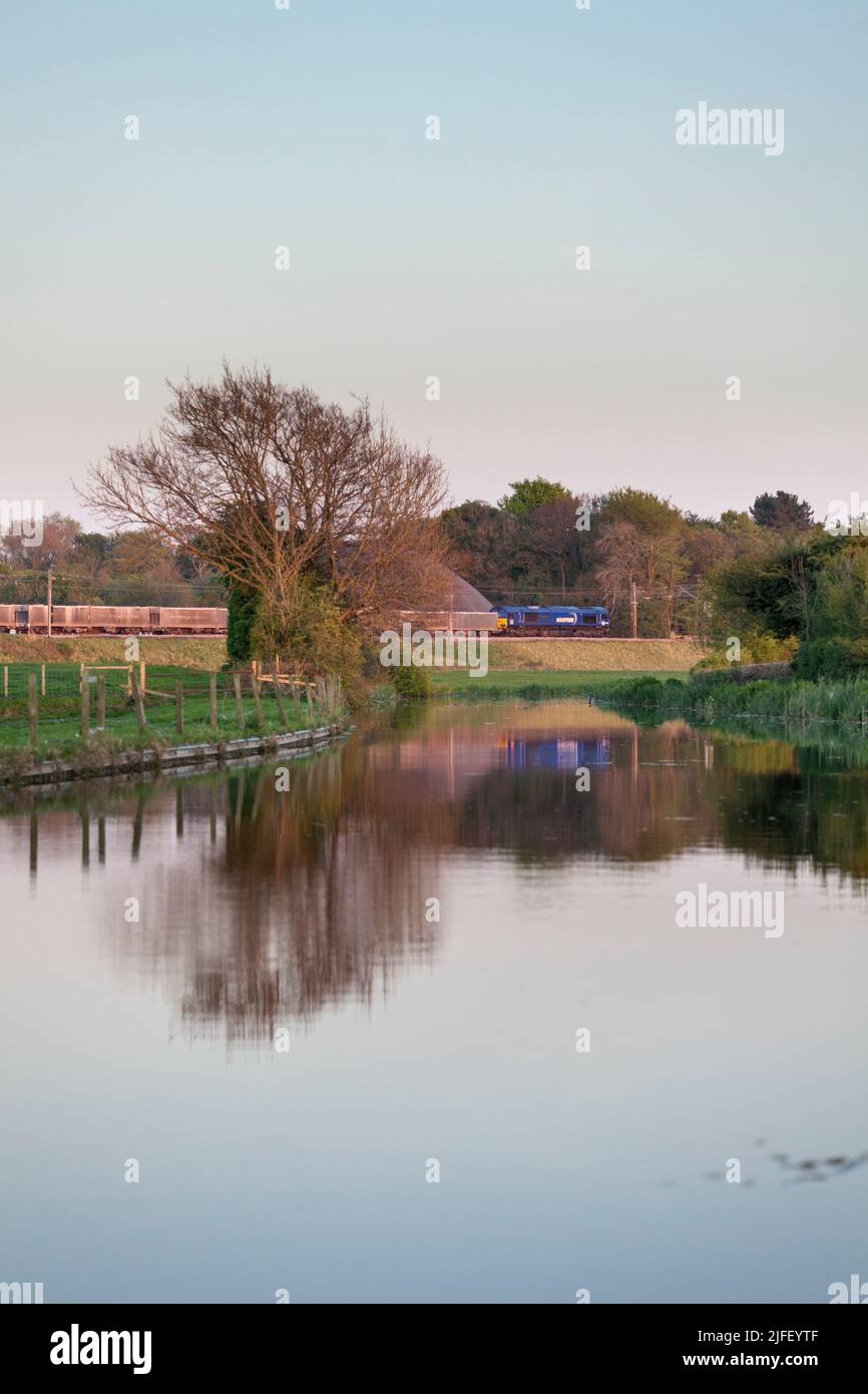 Maritime livery DB Cargo rail UK class 66 locomotive passing Catterall ...