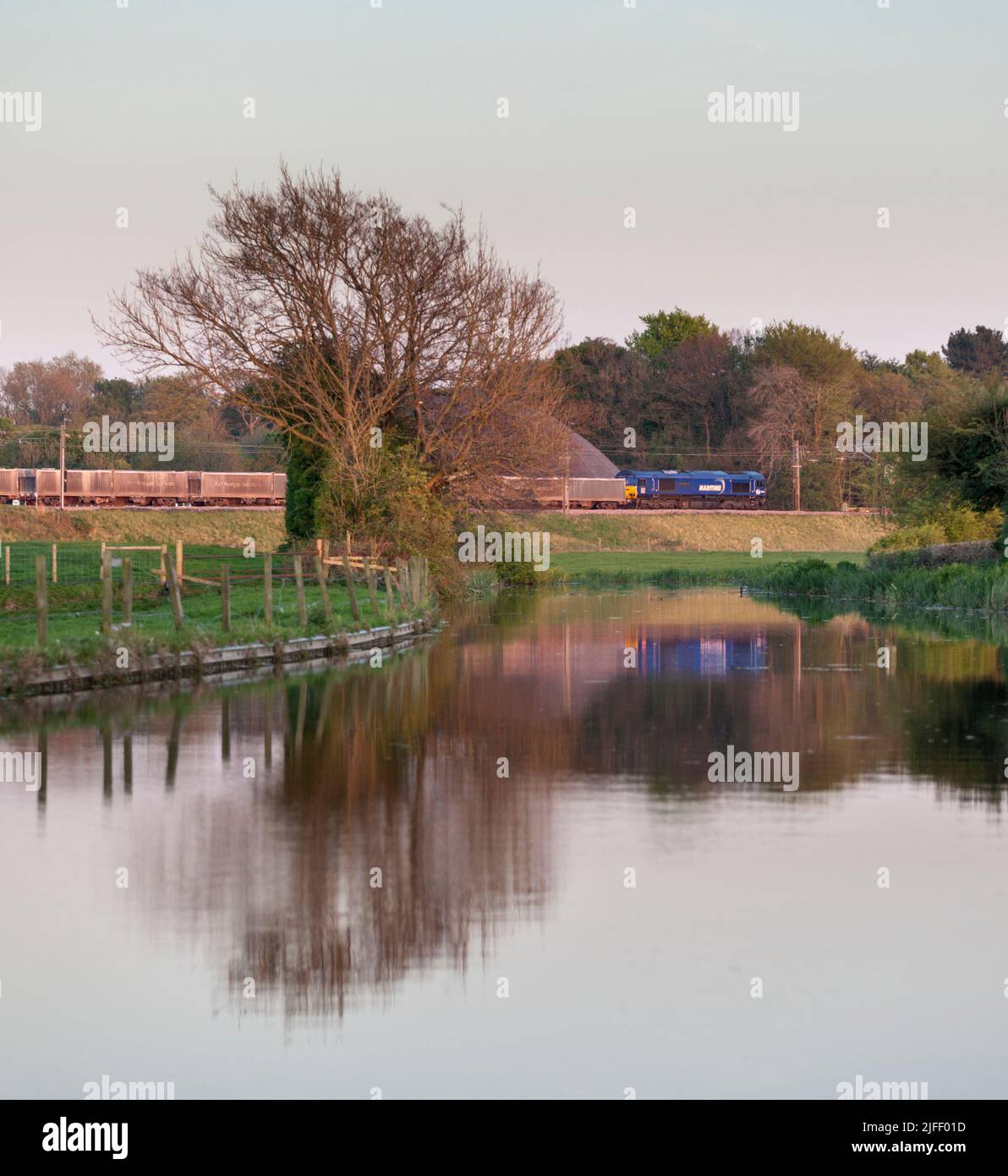 Maritime livery DB Cargo rail UK class 66 locomotive passing Catterall ...