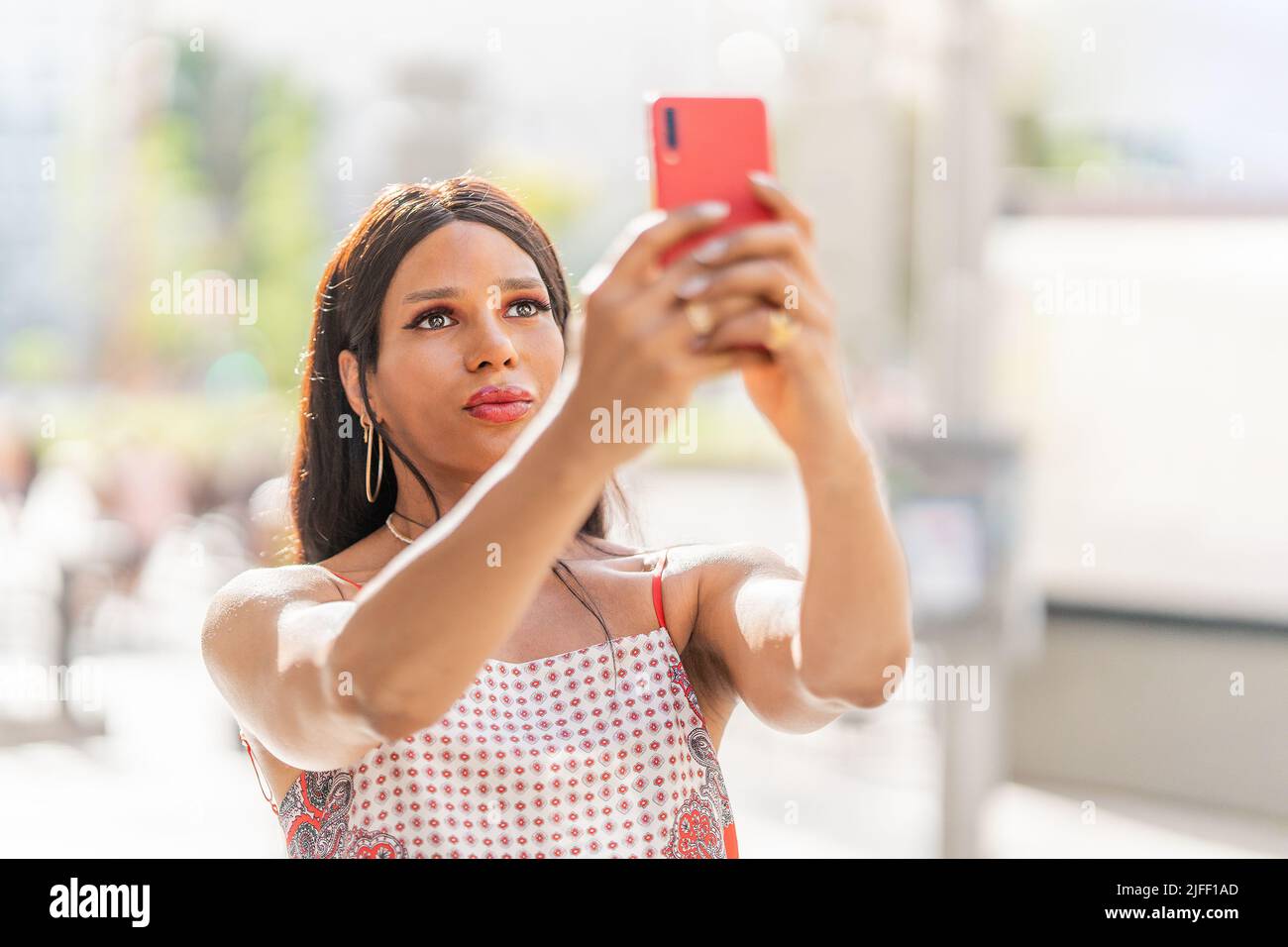 Transgender woman taking a selfie outdoors. Close up Stock Photo - Alamy