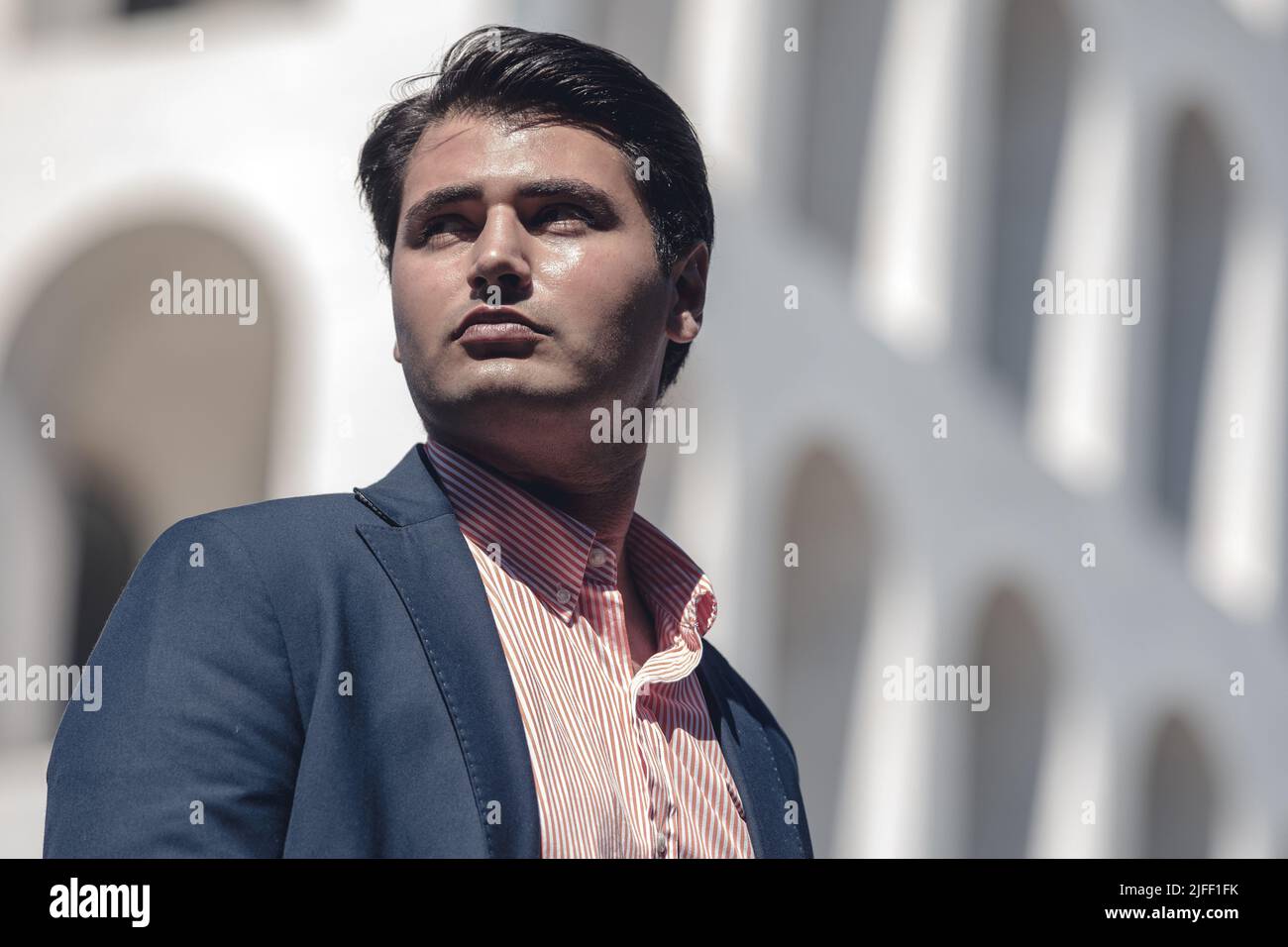 Business man close up portrait. Outdoors. Look into the distance ...