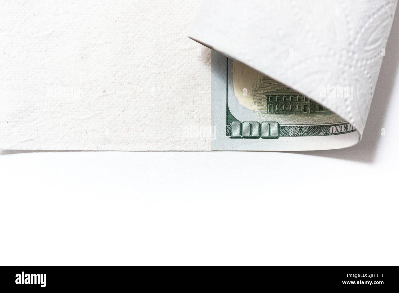Money and inflation. American dollars in toilet paper on a white ...