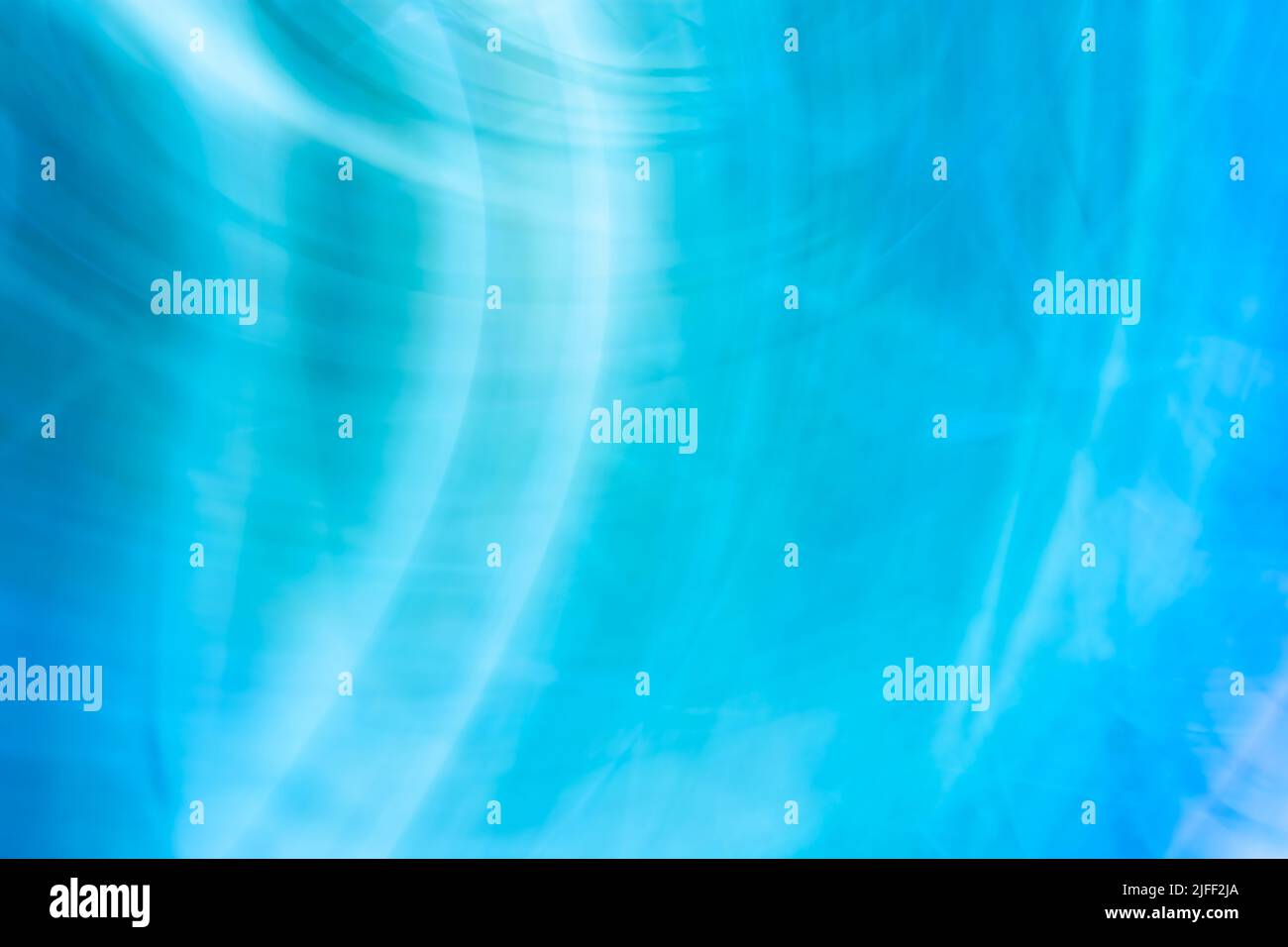 Blue abstract background with gently blurred chaotic white lines waves ...