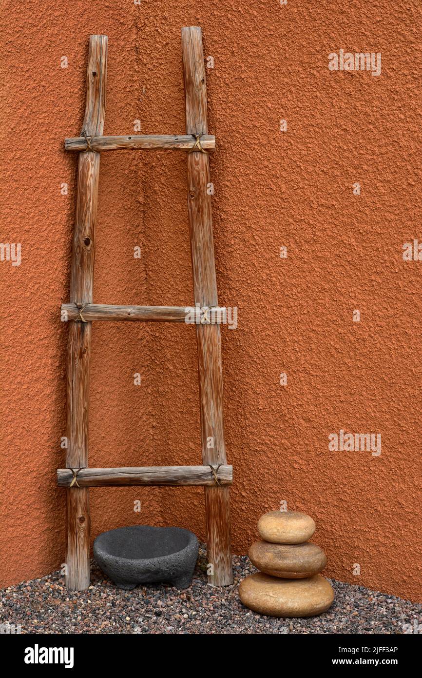 A decorative rustic wooden ladder creates a classic Southwestern USA ...