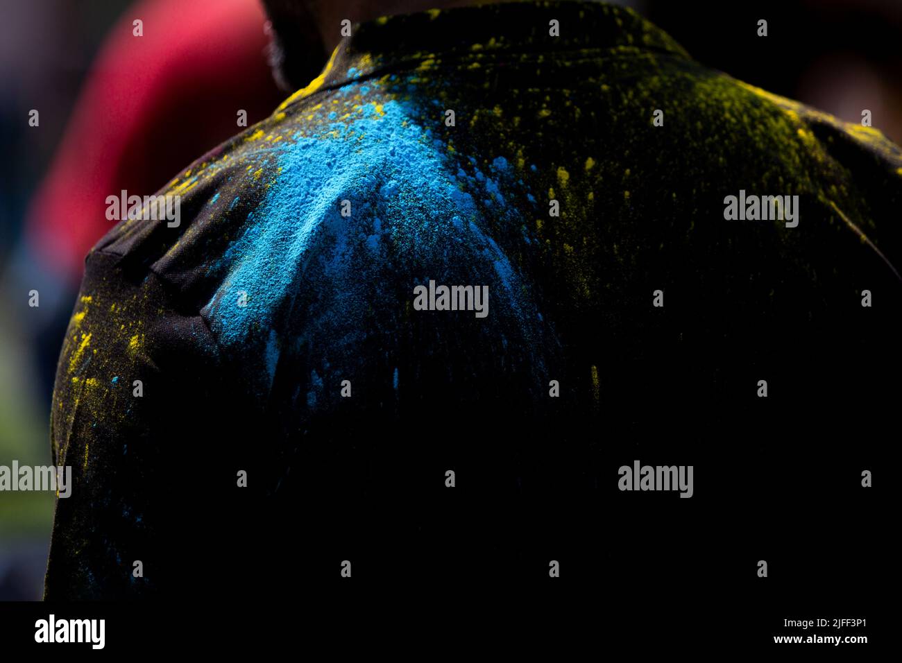 A teenager painted with colors at Colorfest Stock Photo - Alamy