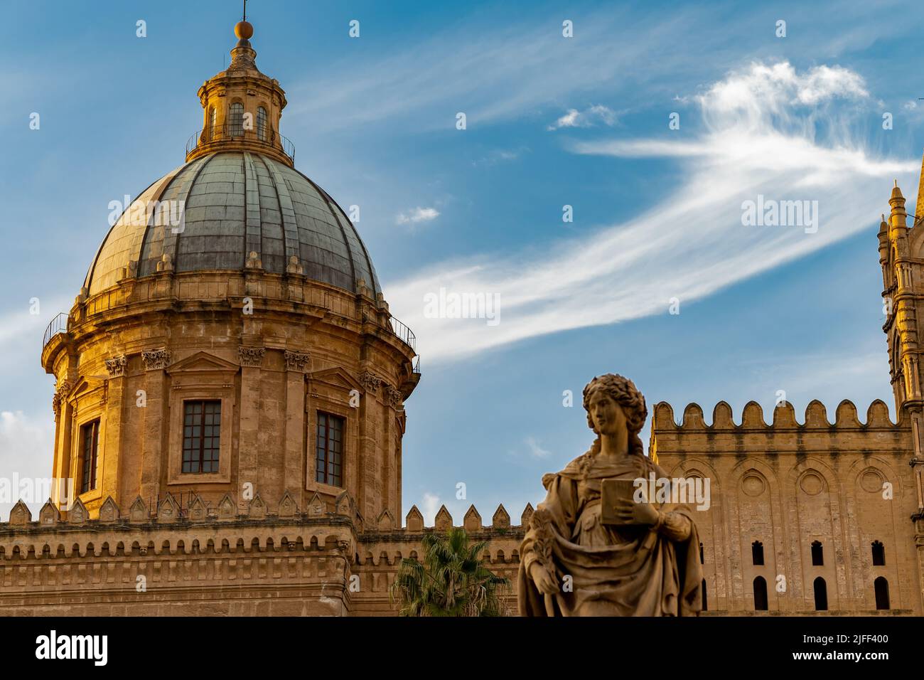 The blue sky over the dome and statue of Palermo Cathedral at daytime ...