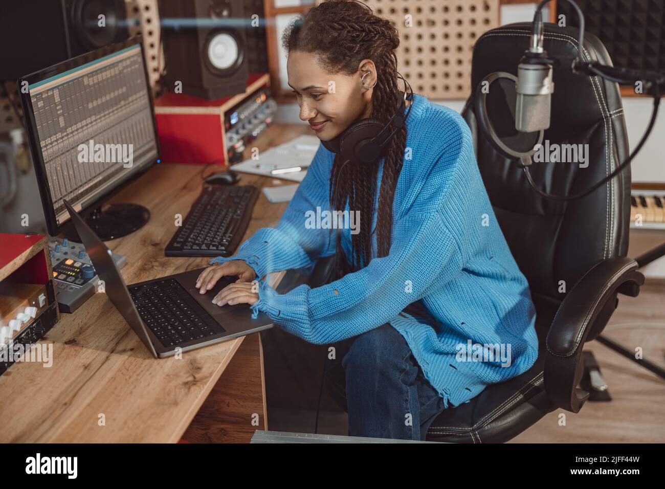 Cheerful African American female composer, producer, musician ...