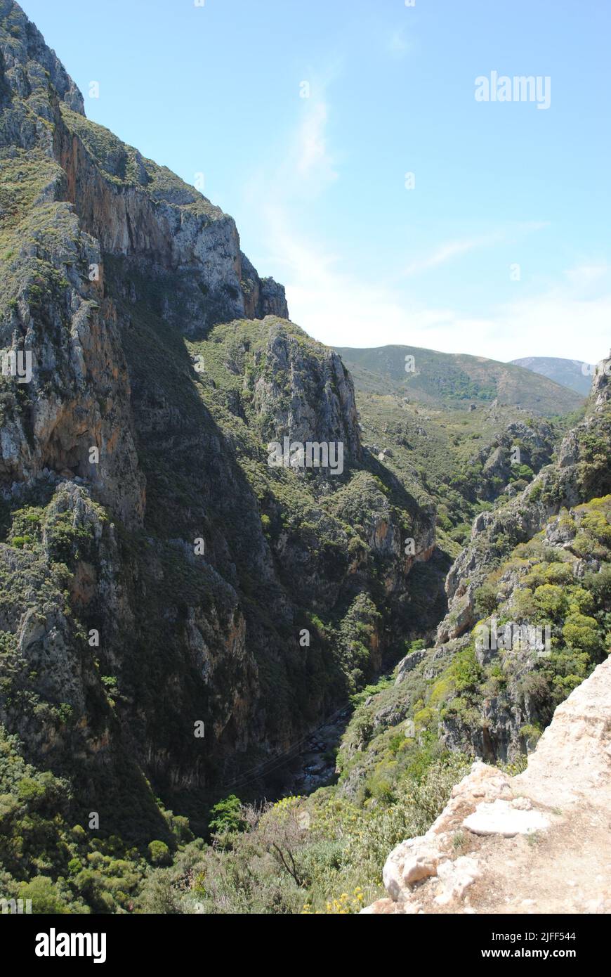 The gorge of Topolia under a blue cloudy sky on a sunny day Stock Photo ...
