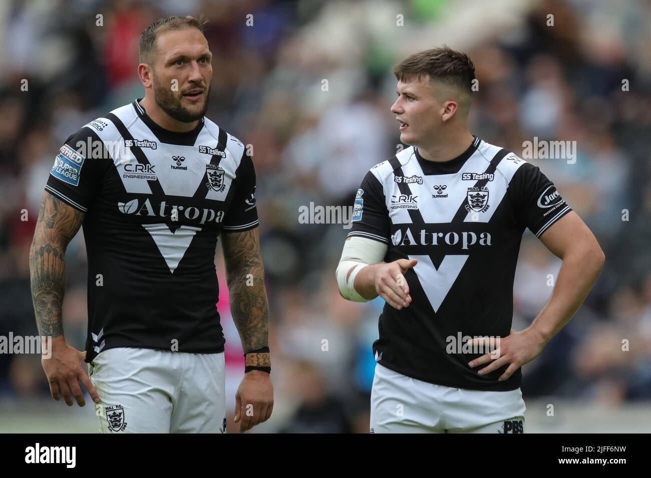 Josh Griffin #4 of Hull FC speaks with Connor Wynne #23 of Hull FC ...