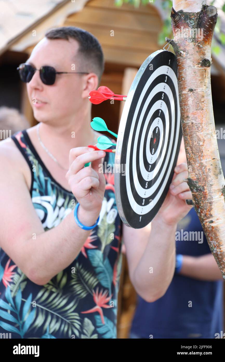 Photo of a dart board hanging from a tree Stock Photo - Alamy