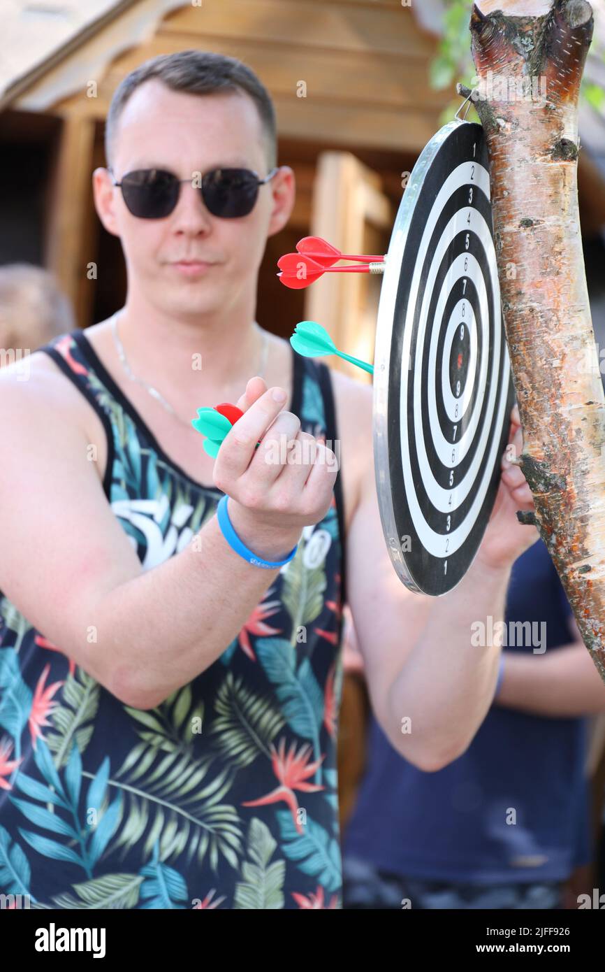 Photo of a dart board hanging from a tree Stock Photo - Alamy