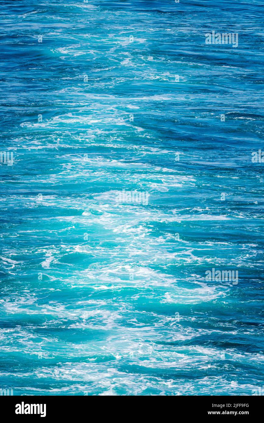 Blue water of the Pacific ocean behind cruise ship sailing in Alaska ...
