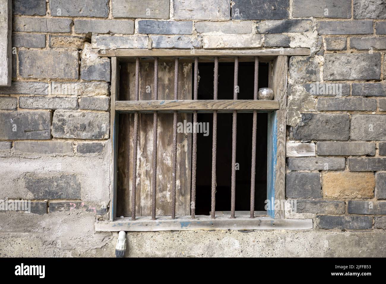 A view of an old jail window bars of a brick-built building Stock Photo ...