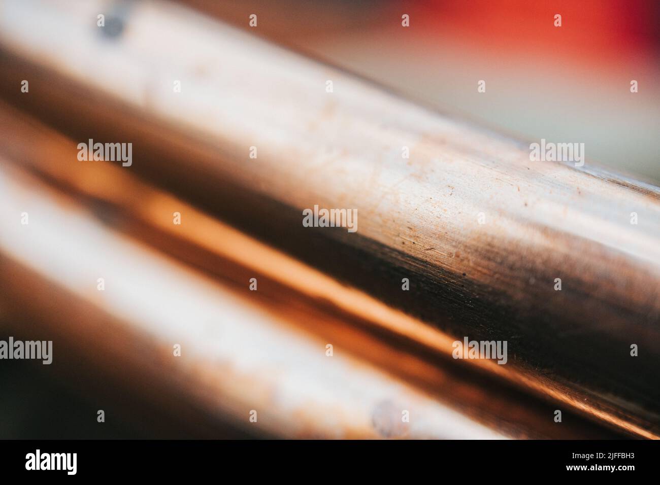 A macro photograph of copper pipe that will be used for HVAC unit to ...