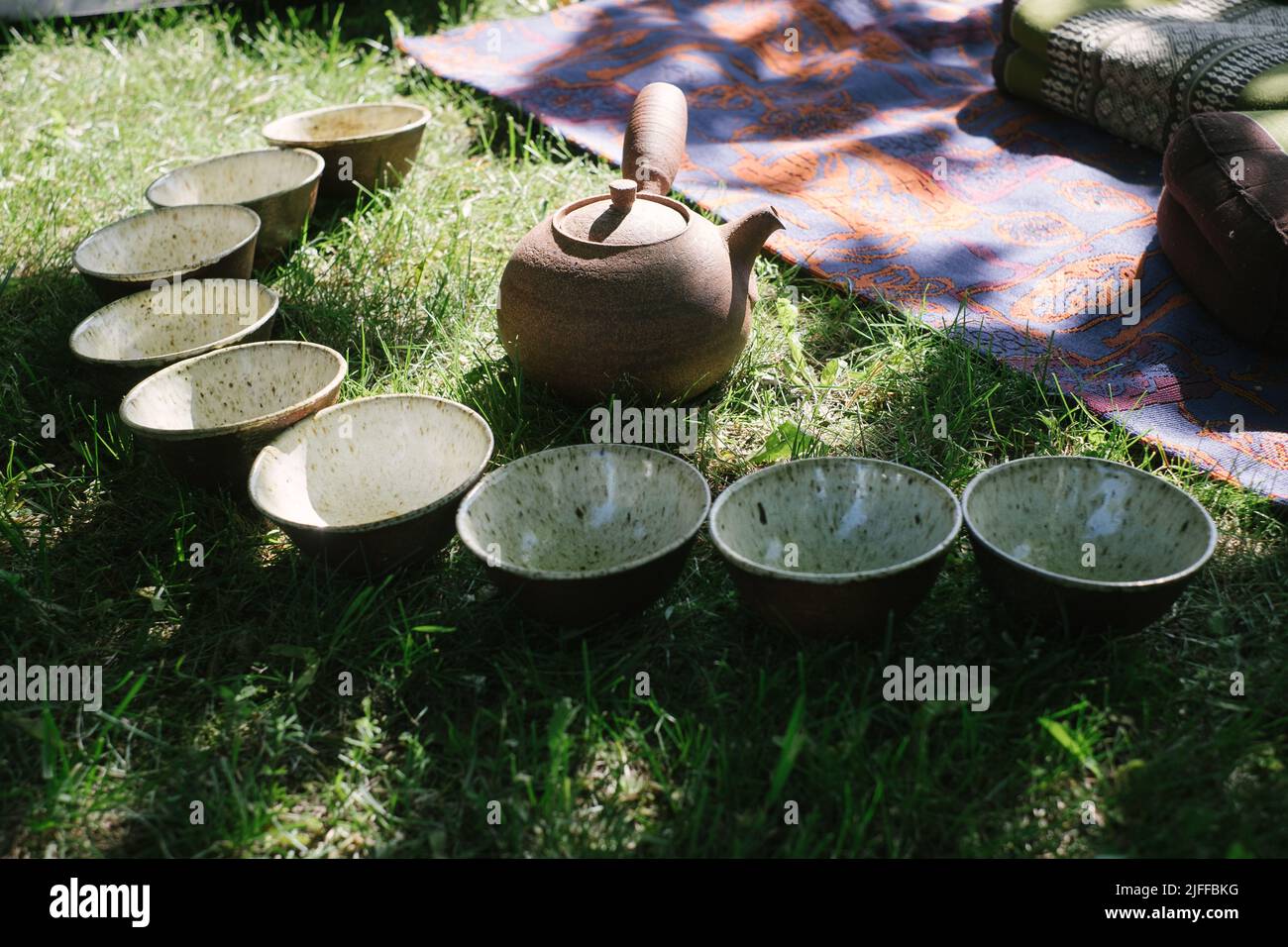 Tea ceremony setting in nature during summer. Handicraft ceramic tea ...