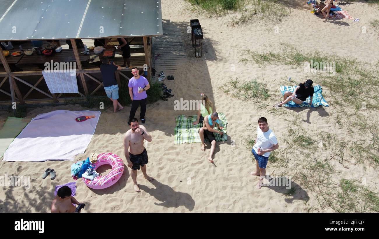 Drone photo of people resting on beach Stock Photo - Alamy
