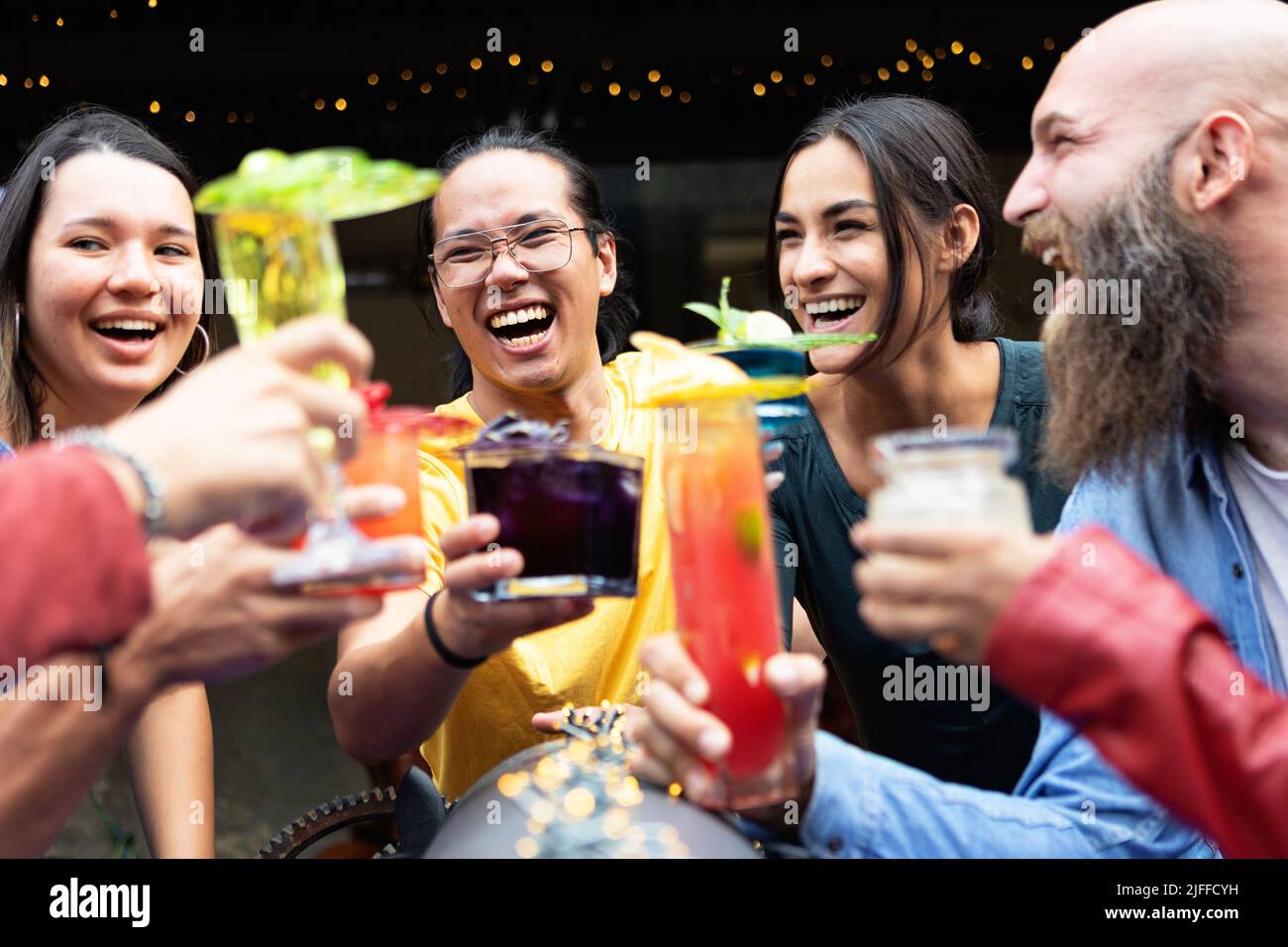 Happy millennial people having fun on summer holidays toasting fancy ...