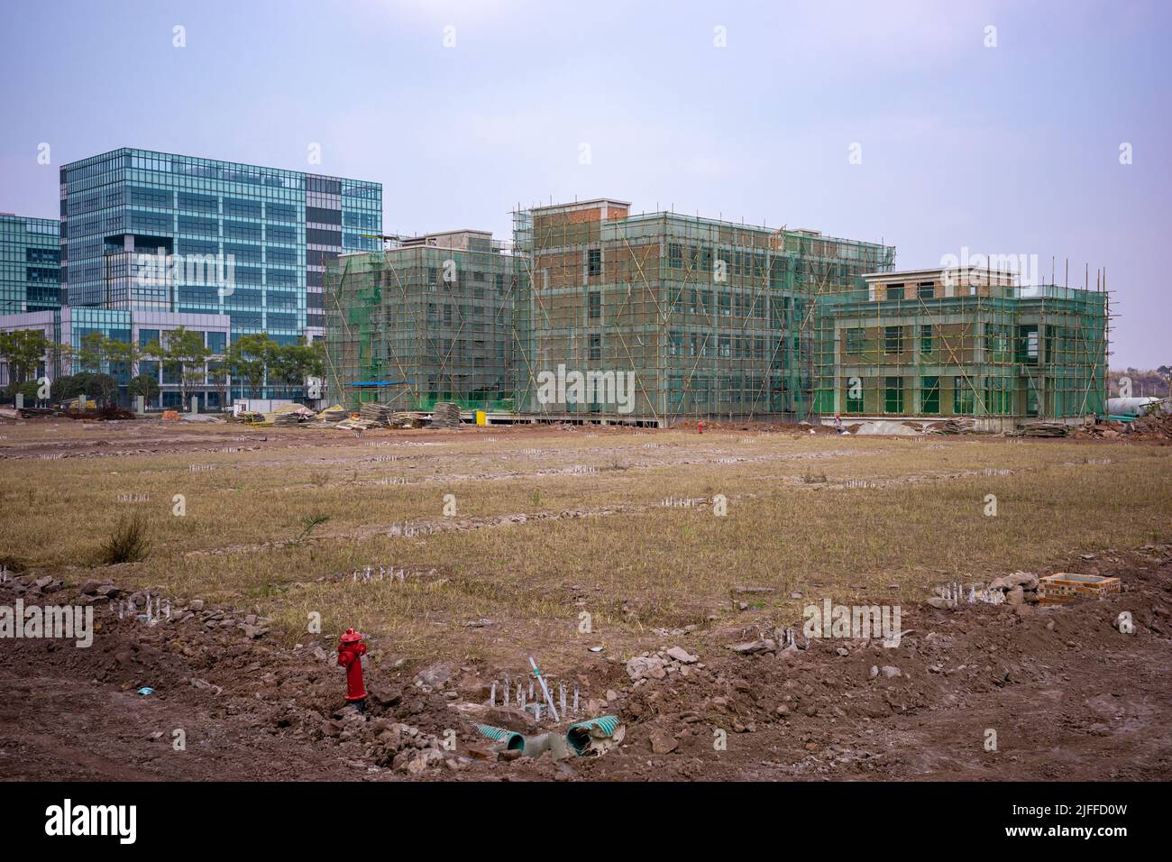 A view of buildings and constructions in a dry field Stock Photo - Alamy