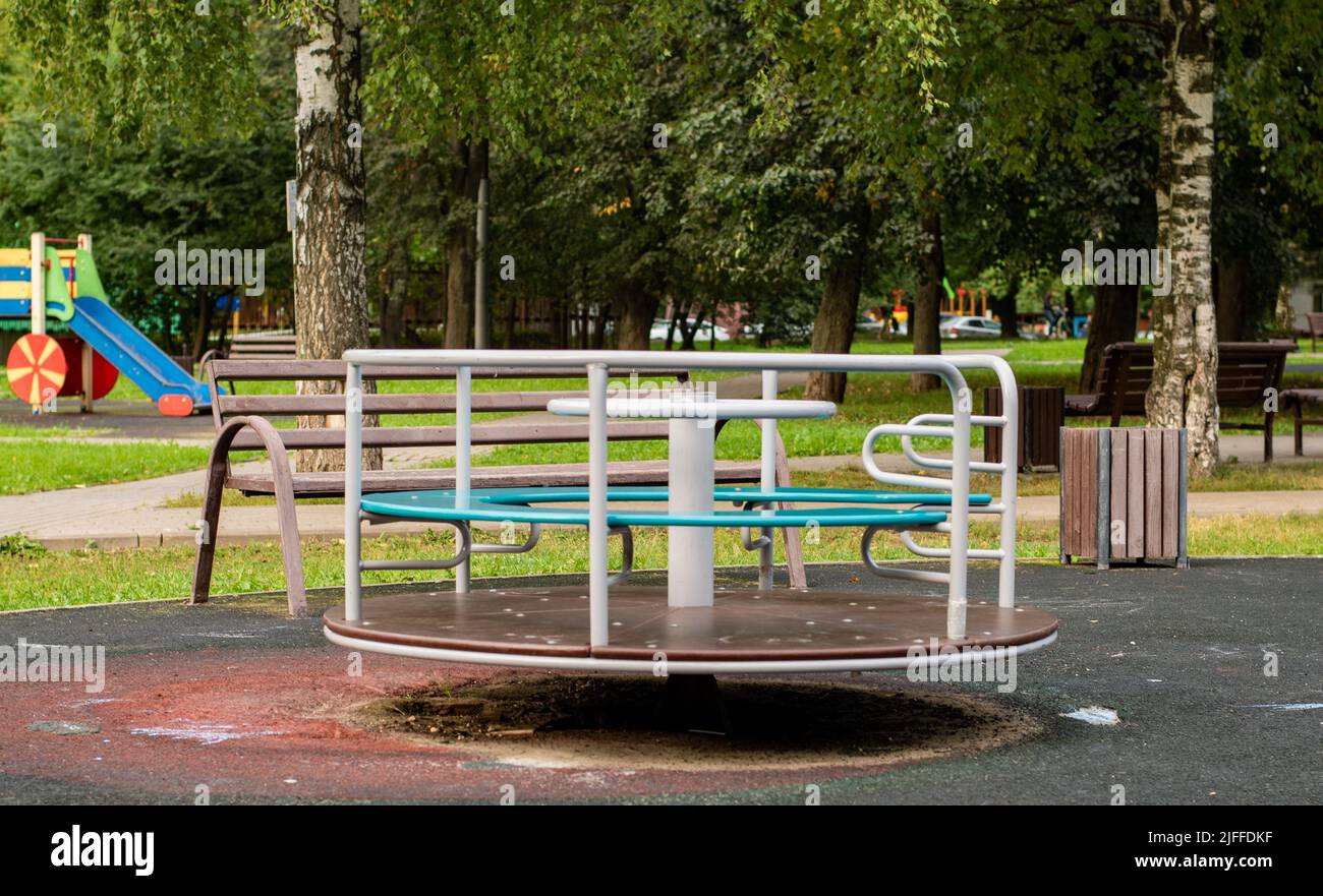 Carousel on the playground in the park in Moscow Stock Photo - Alamy