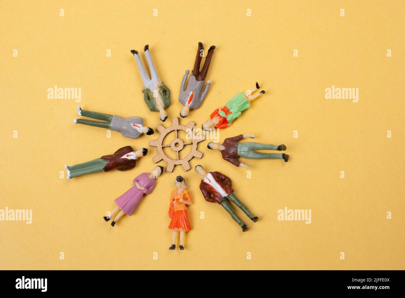 Colorful diverse miniature people figurines make crowd on ground Stock ...