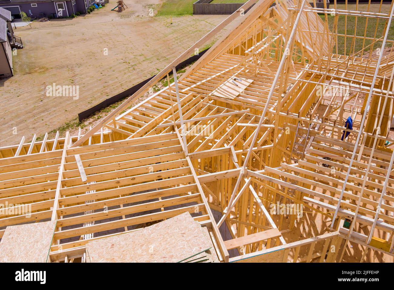 An aerial view of an unfinished house with a wooden beam house ...