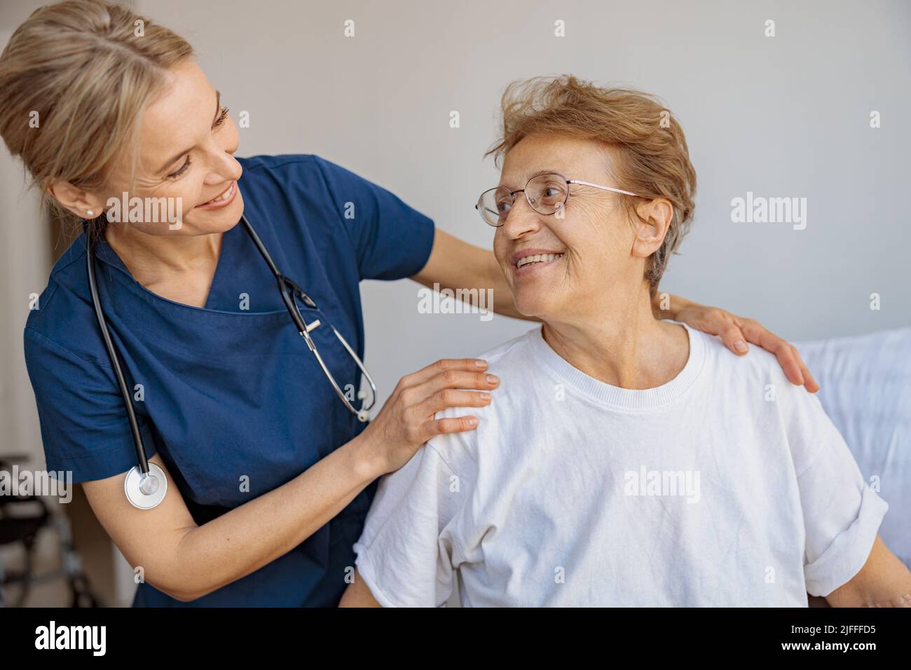 Doctor supporting a sick patient before medical procedures in a ...