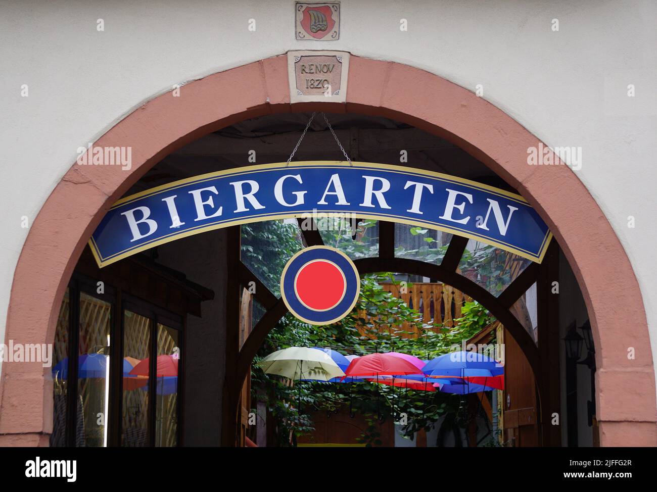 The entrance of Biergarten with umbrella decorations Stock Photo - Alamy