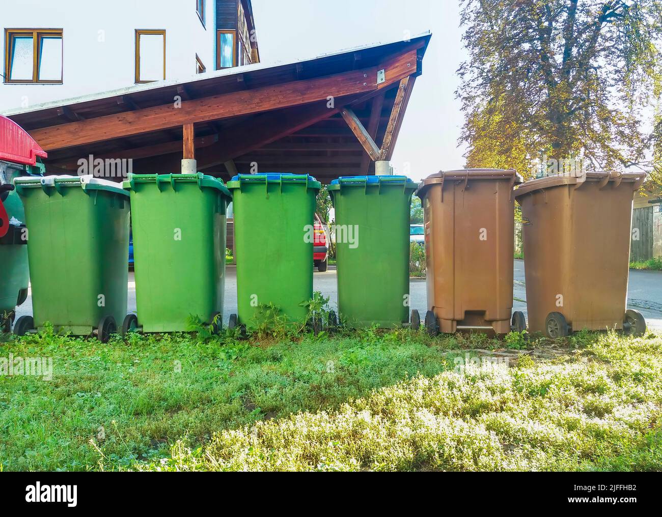 Garbage cans in different colors for waste management, trash recycling ...