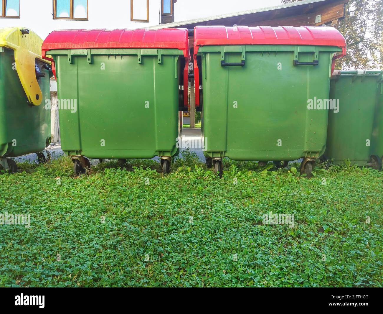 Garbage cans in different colors for waste management, trash recycling ...