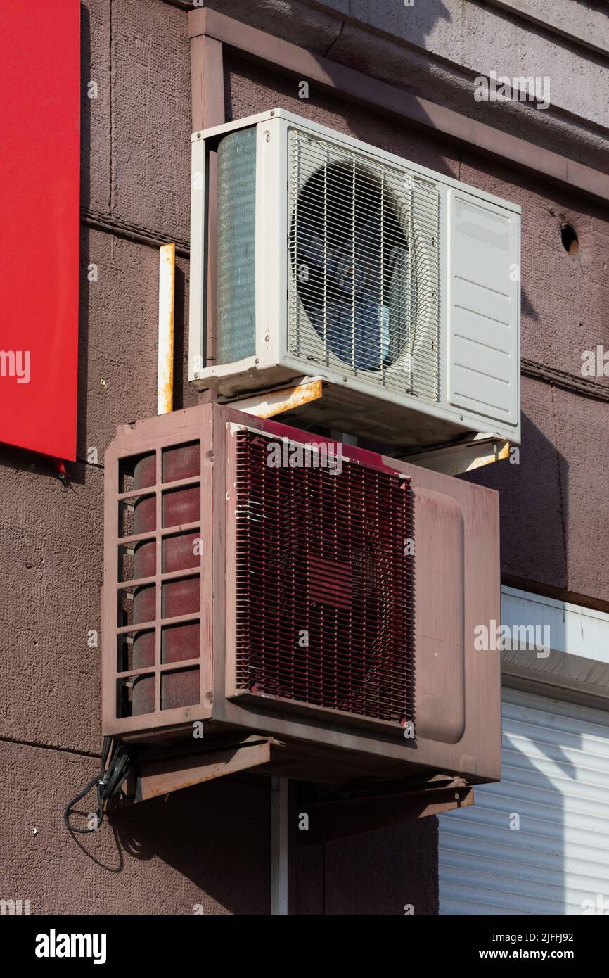 air conditioning unit Central split system hanging outside the building ...