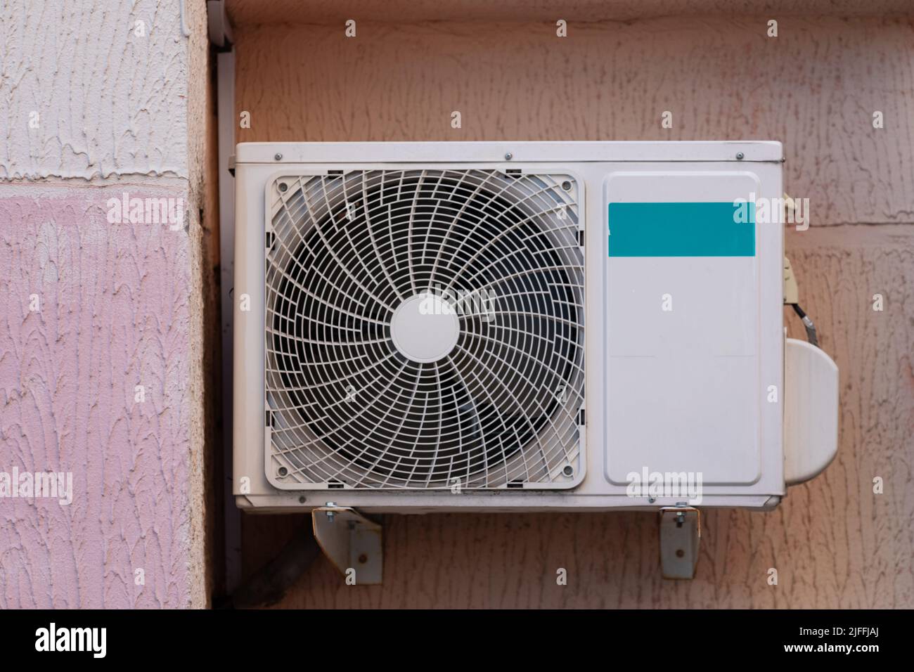 air conditioning unit Central split system hanging outside the building ...