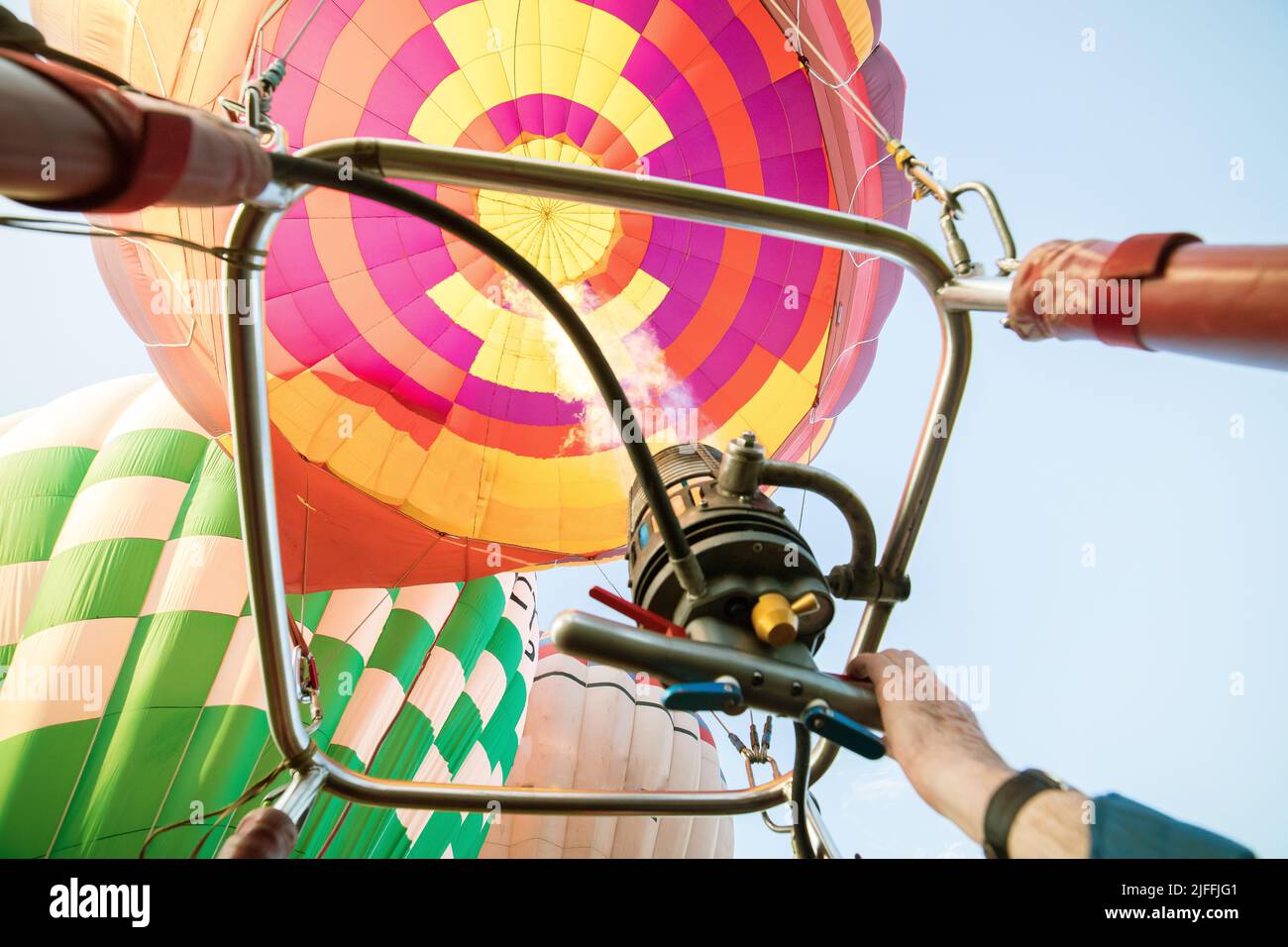 People heating up the balloon and taking it off in the air Stock Photo ...