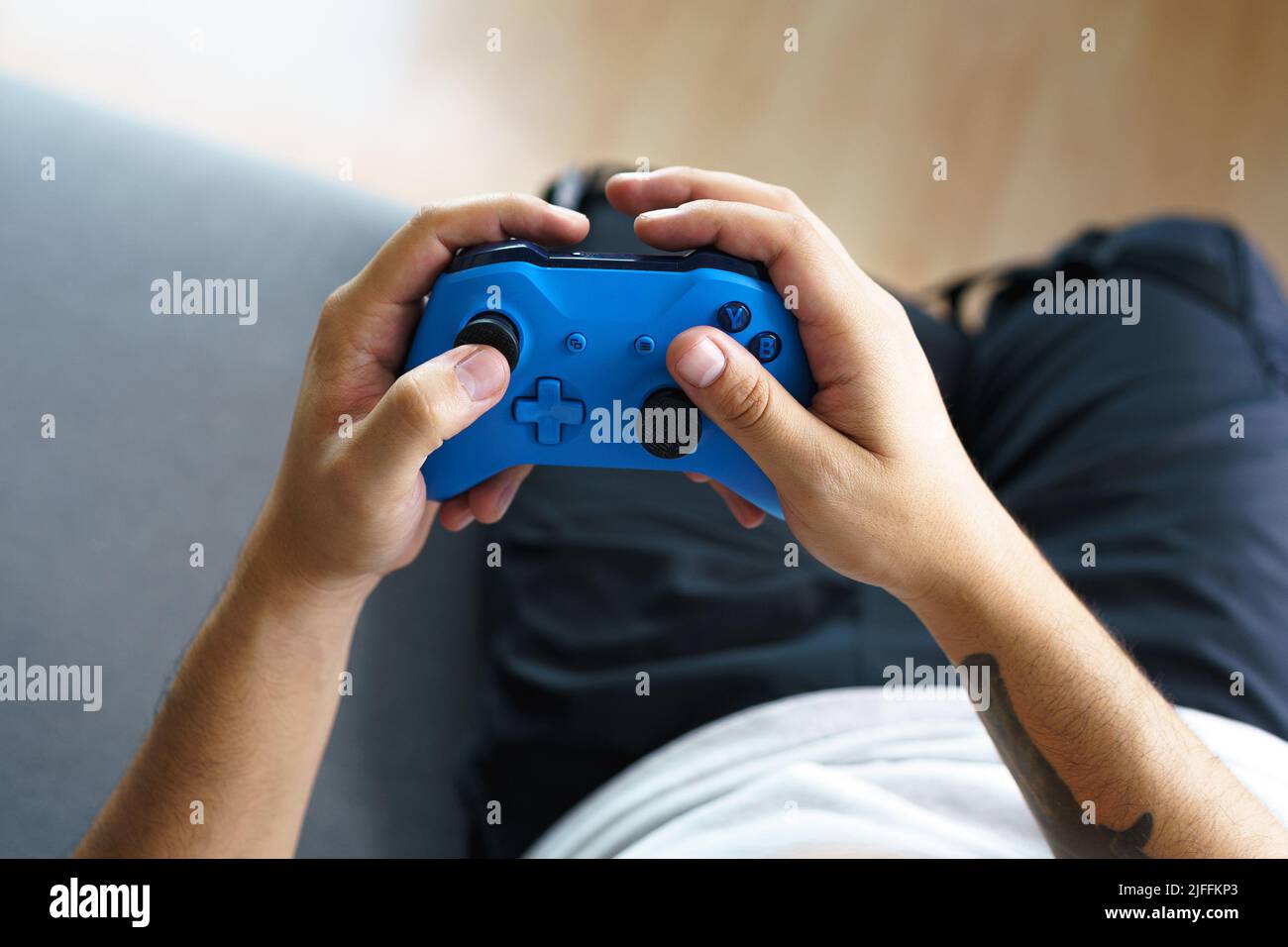 Remote blue video game control details, relaxed lifestyle with modern ...