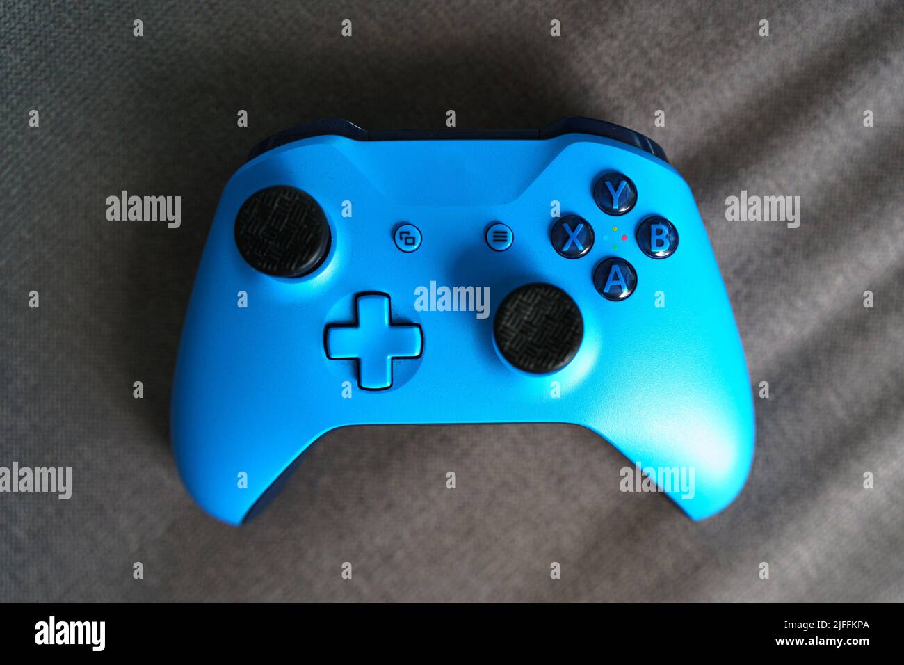 video game control in blue color, detail of buttons and joystick ...