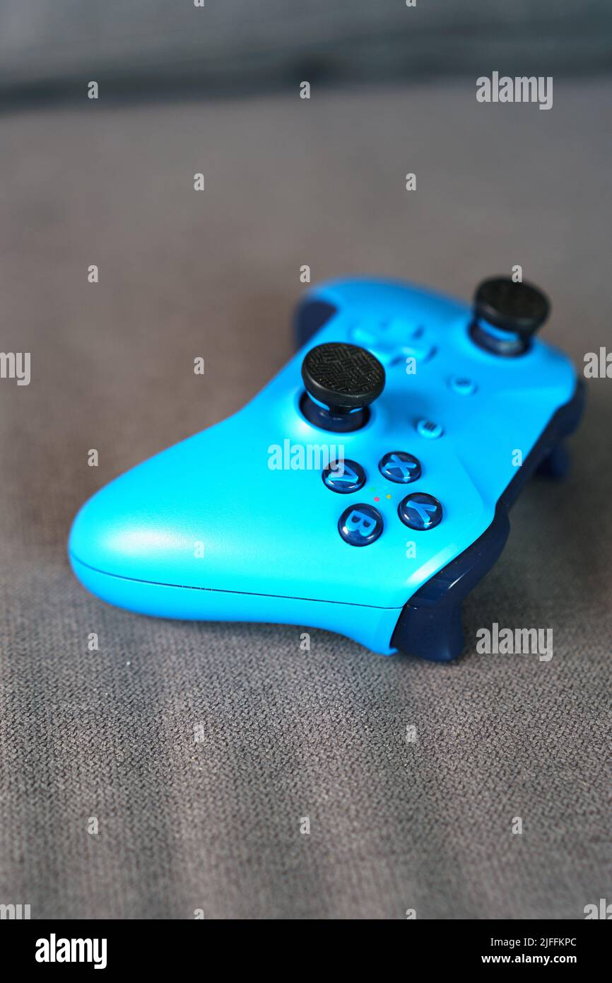 detail of blue video game control, close up to buttons and joystick ...