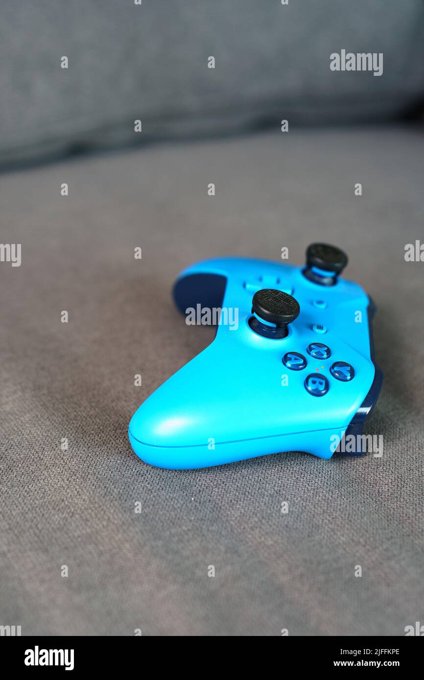 blue video game control, close up to buttons and joystick ...