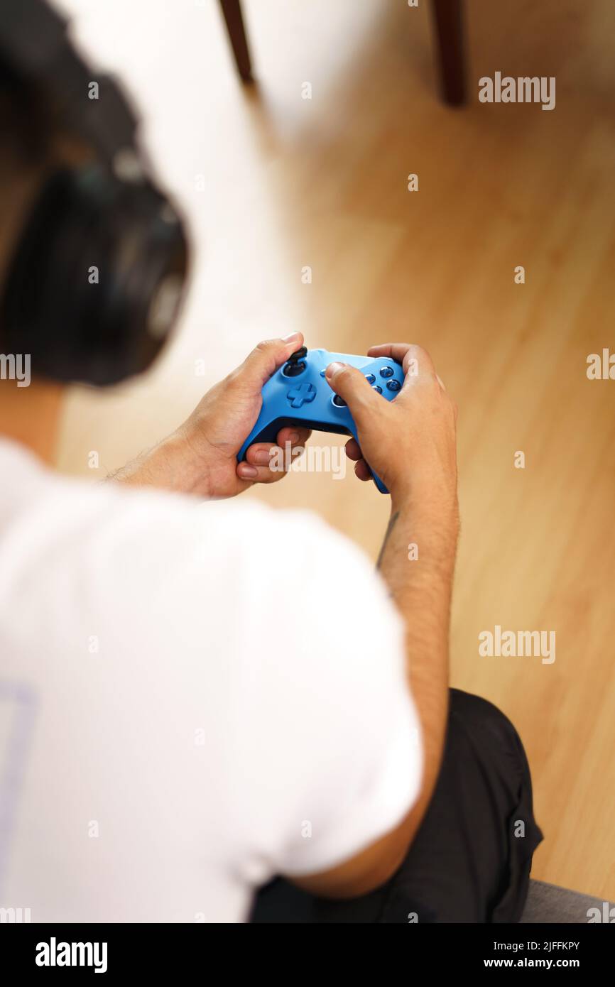 details of hands with the remote control of video games, modern ...