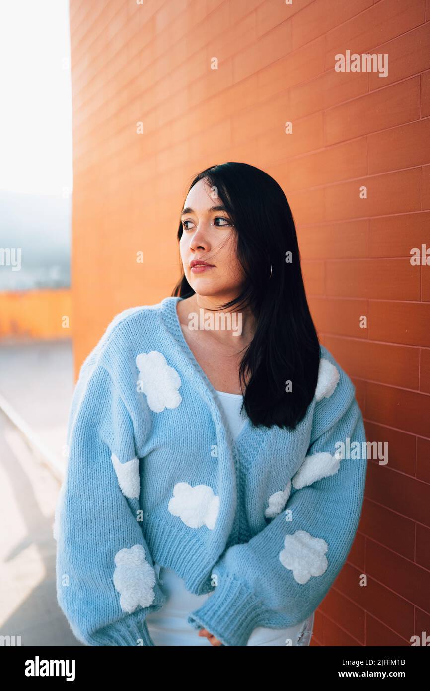 face of young latin woman with black hair, details of facial skin ...