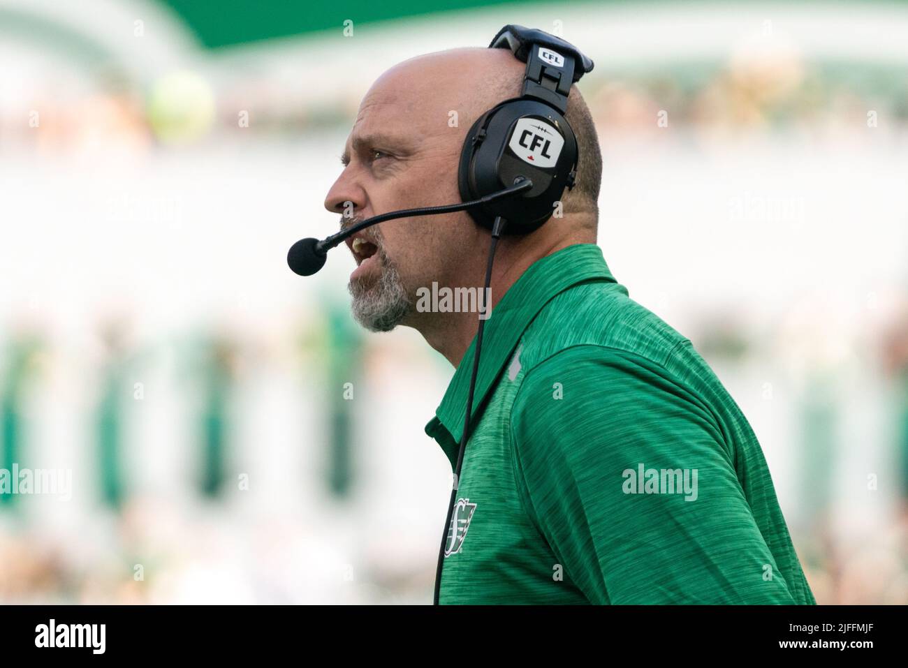 Saskatchewan Roughriders head coach Craig Dickenson watches the play ...