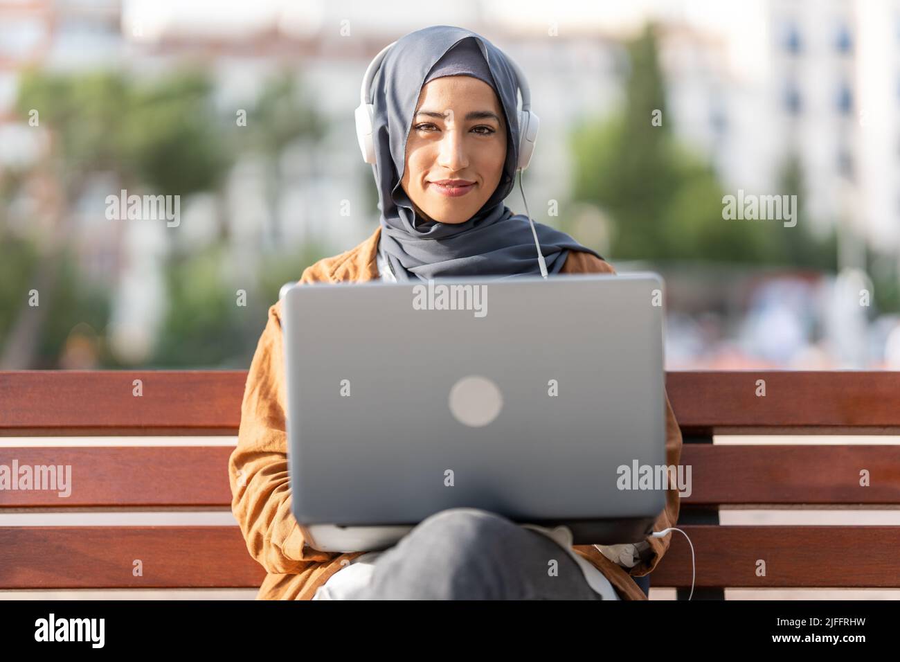 Portrait of a muslim woman using a laptop Stock Photo - Alamy
