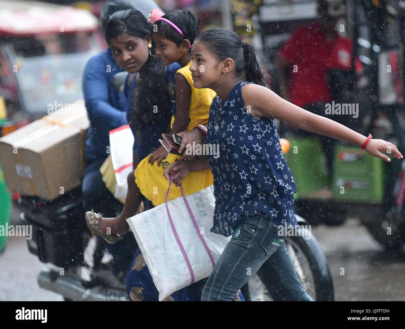Commuters walk during heavy rains in Agartala. Tripura, India Stock ...