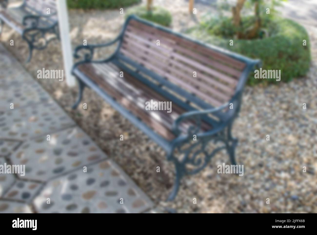 Close up blurred retro bench in the park Stock Photo - Alamy