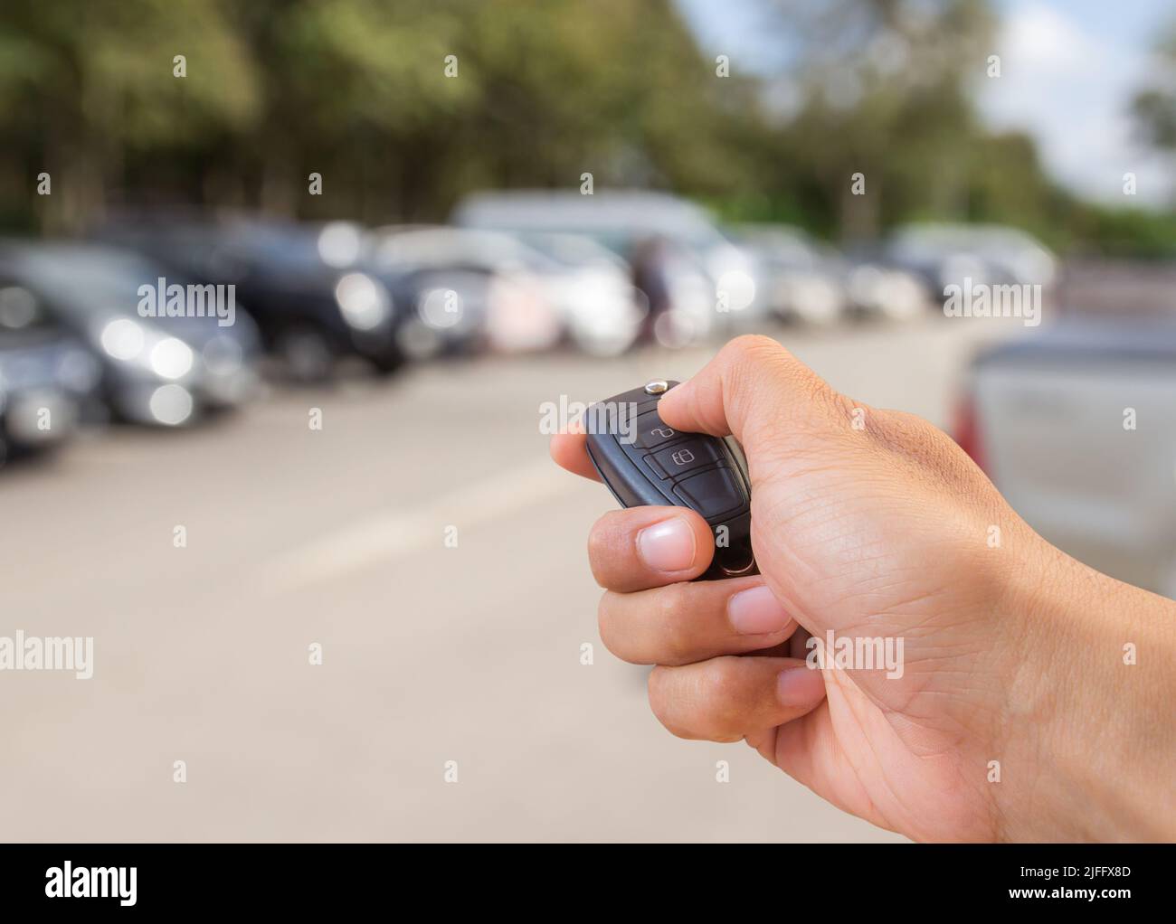 Close up Hand holding car key Stock Photo - Alamy