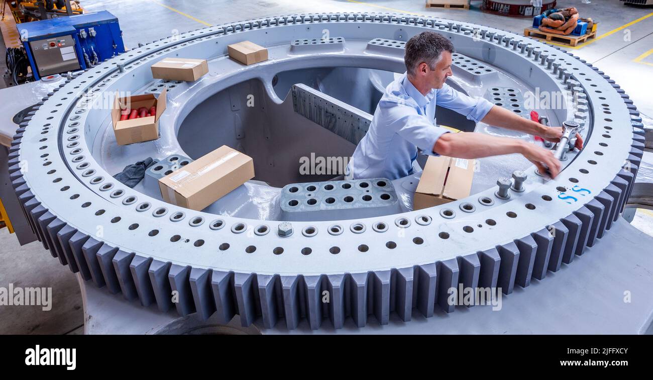 Rostock, Germany. 30th June, 2022. Employee Tony Maas works on the ...