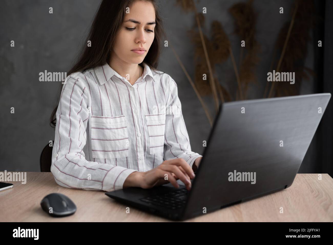 Happy young beautiful woman using laptop, indoors. girl typing on the ...