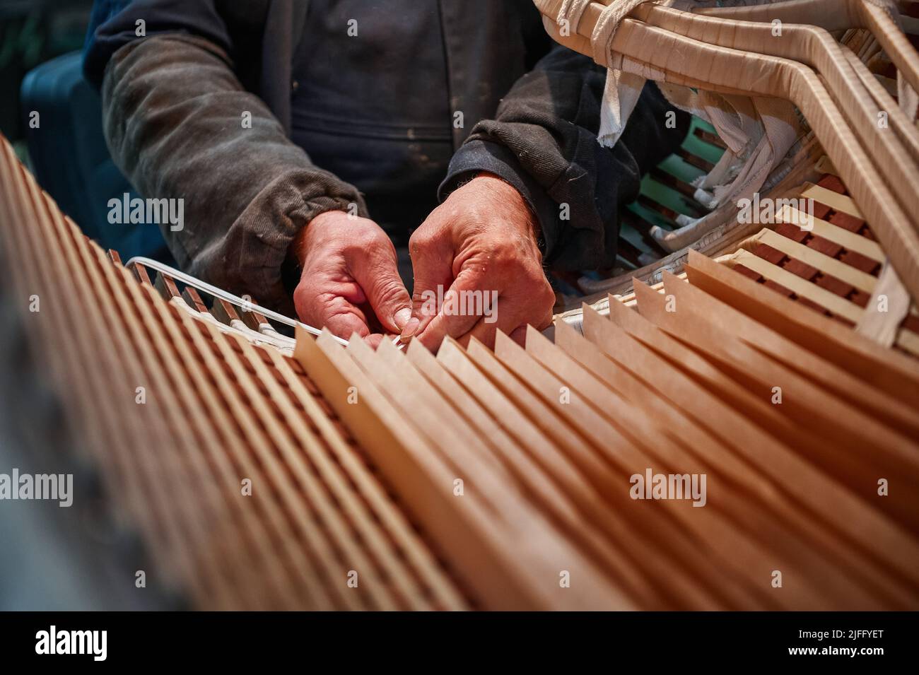 Mature worker wraps copper bus bars with insulation textile Stock Photo ...