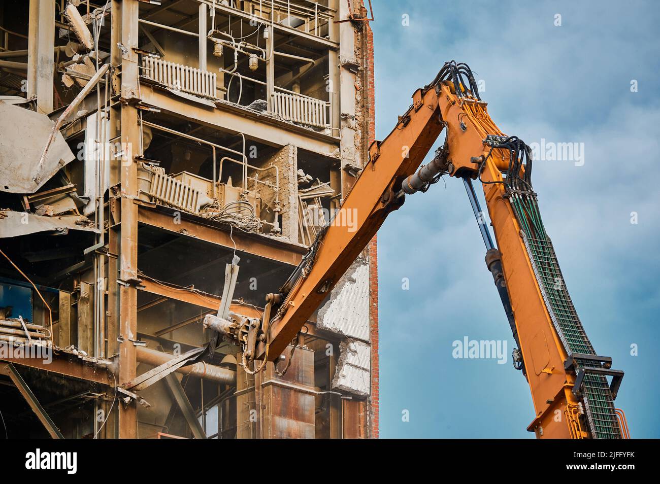 Destroying of old industrial building by excavator destroyer Stock ...