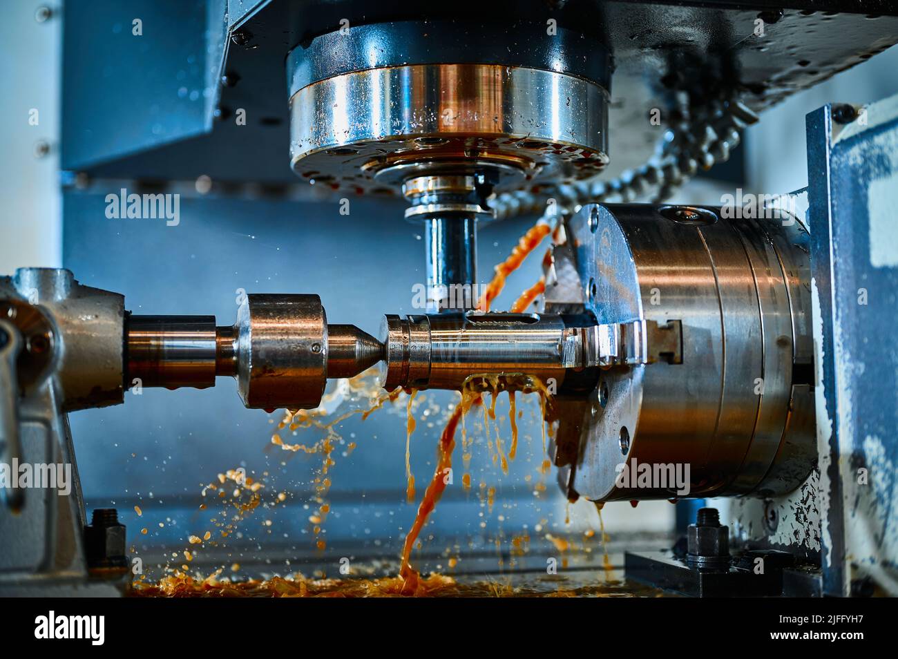 Lathe machine tool operates with metal part in workshop Stock Photo - Alamy