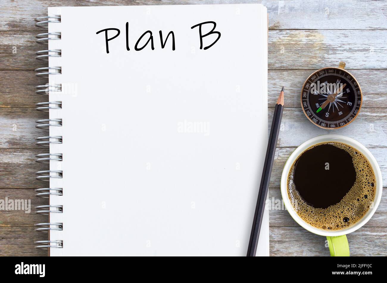 Plan B written on notebook with pencil and cup of coffee with copy ...