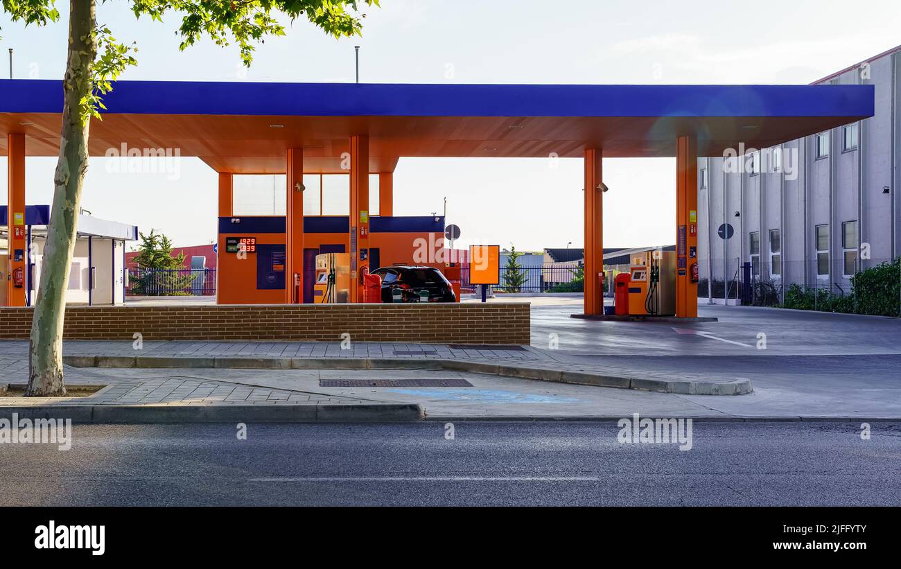 Gas station to refuel in an industrial area with high prices due to the ...